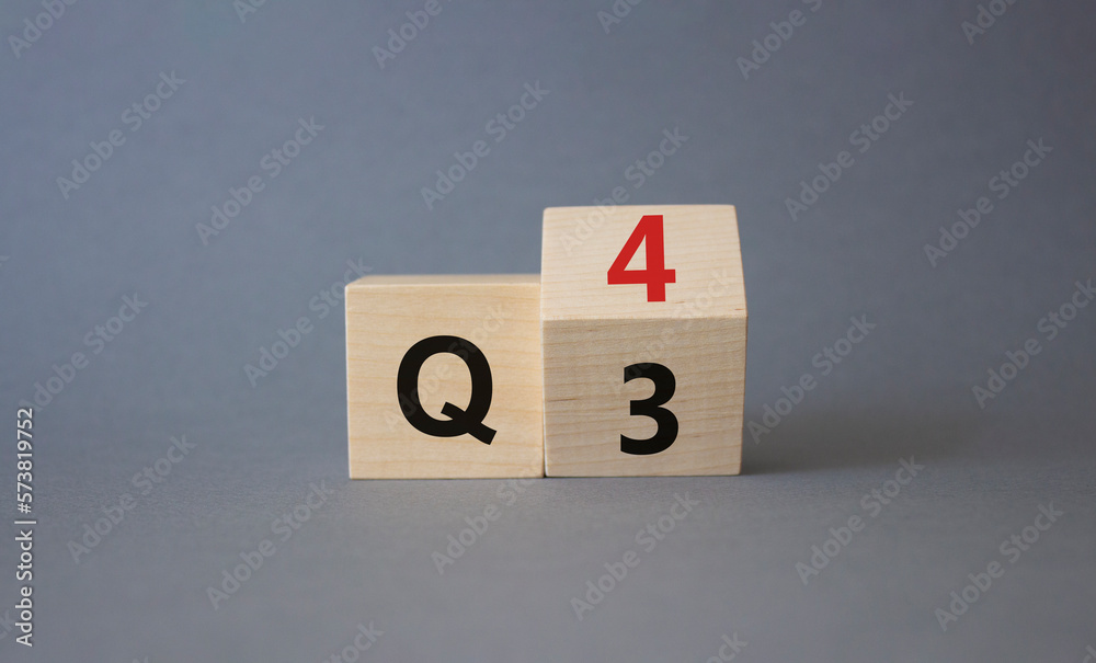 From 3rd Quarter to 4th symbol. Turned wooden cubes with words 3rd ...