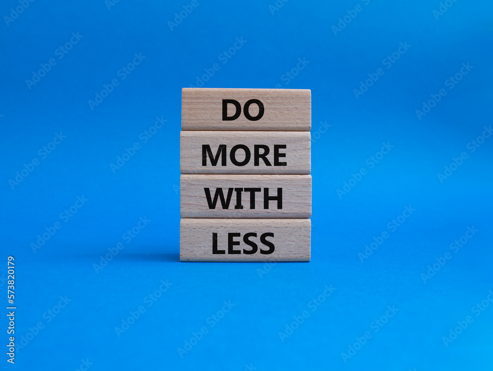 Do more with less symbol. Concept words Do more with less on wooden ...