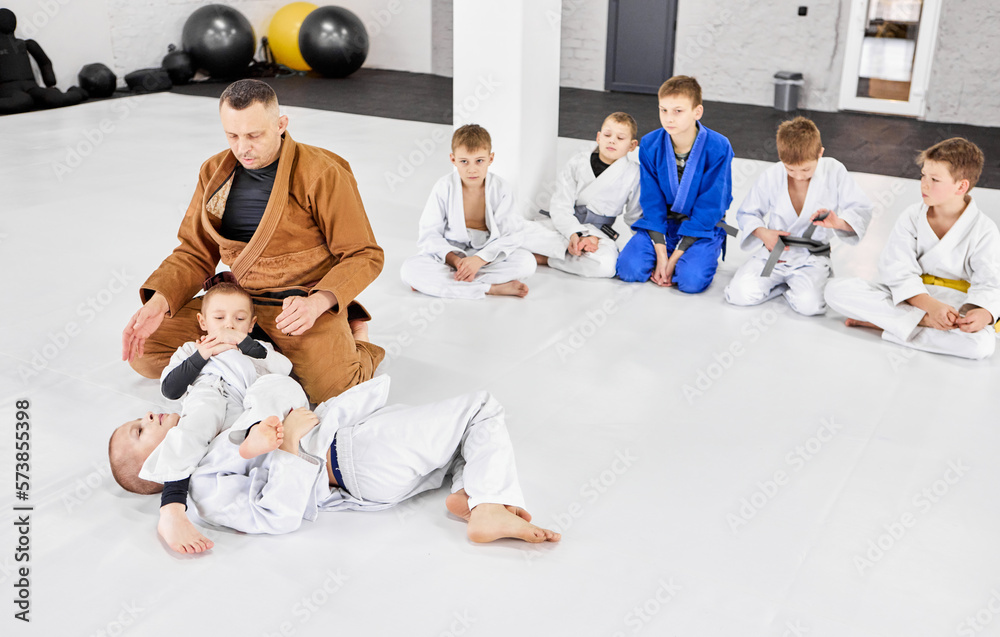 Boys, children in white kimono training judo, jiu-jitsu fight style ...
