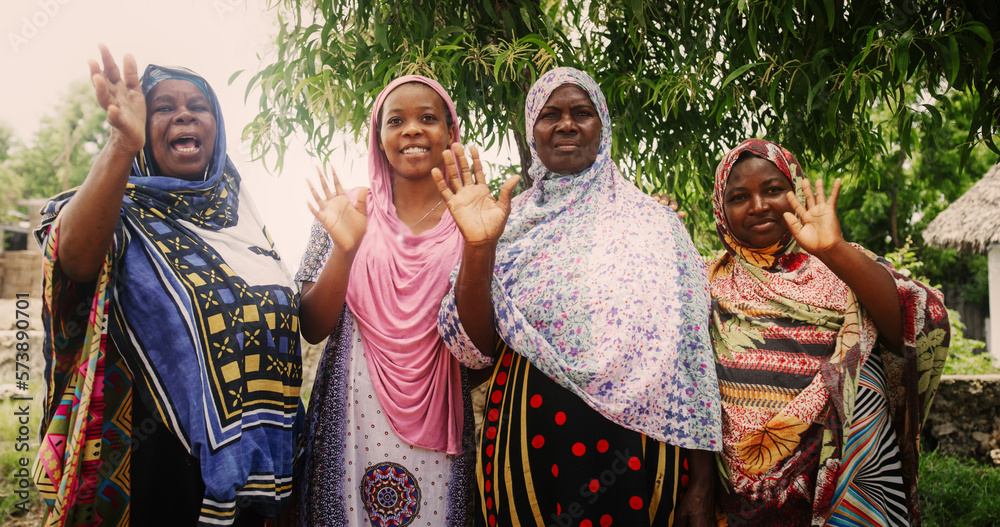A Group of Authentic African Women in Traditional Clothes Waving and ...