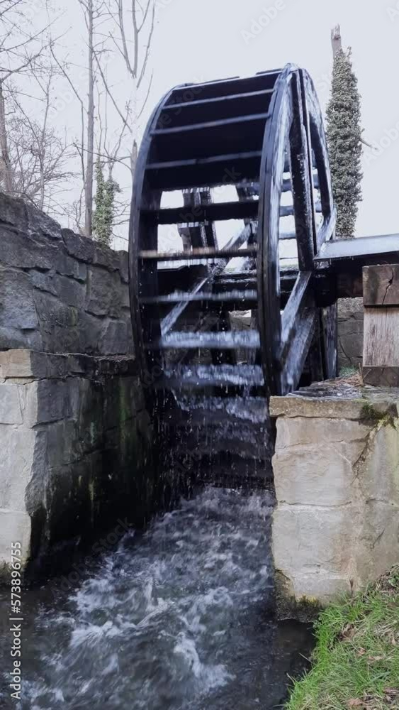 Work of water mill. Vertical video of water wheel that demonstrates ...