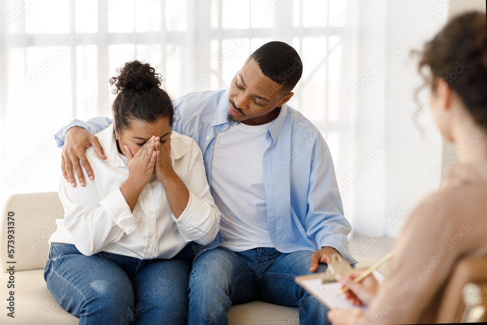 Loving black man comforting crying girlfriend, attend family therapy ...