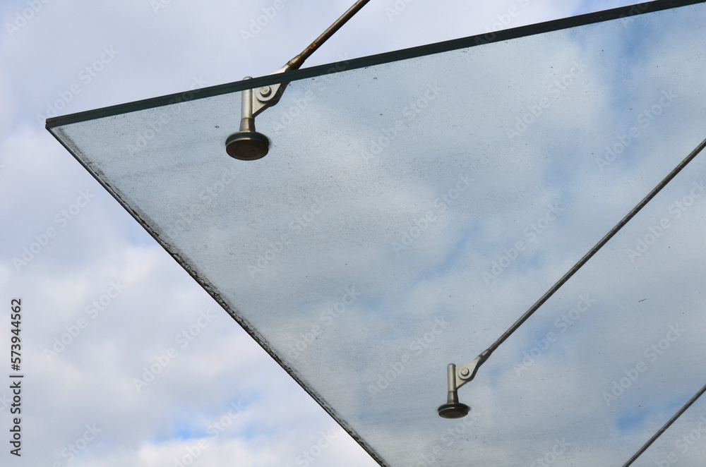 Glass roof above the entrance to the industrial building with metal ...