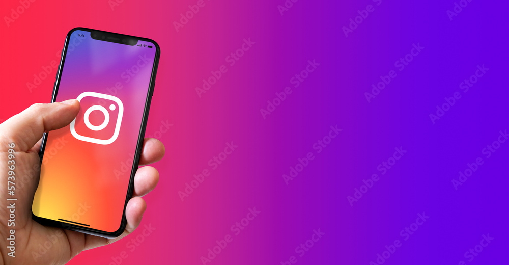 Hand holding iphone smartphone with Instagram logo, Paris, France Stock ...