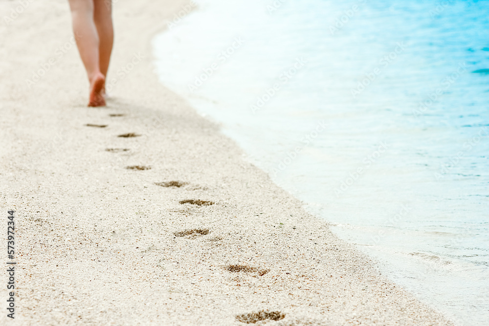 beautiful footprints in the sand by the sea background Stock Photo ...