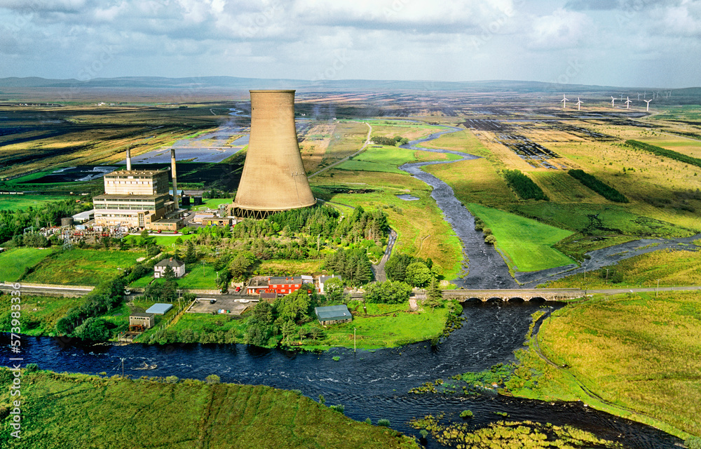 Bellacorick peat turf fired power station and wind turbines at the centre of the vast peat bog ...