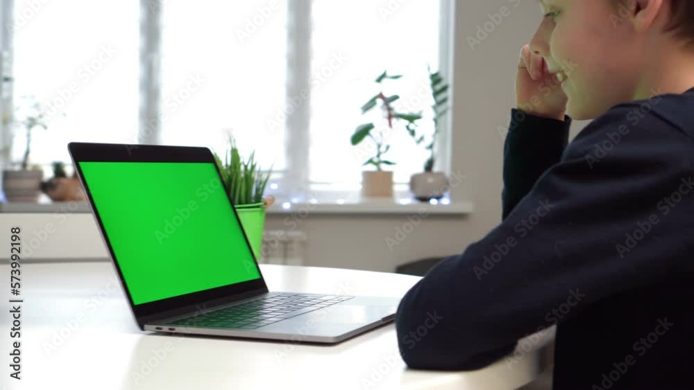Digital green screen chroma key laptop computer on home table, side ...