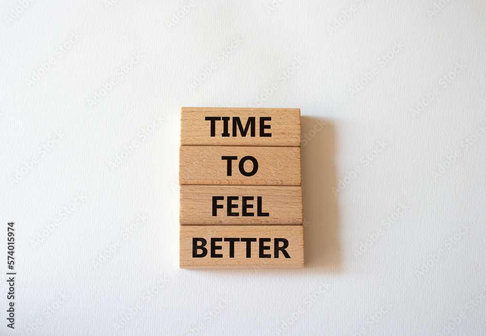 Time to feel better symbol. Wooden blocks with words Time to feel ...