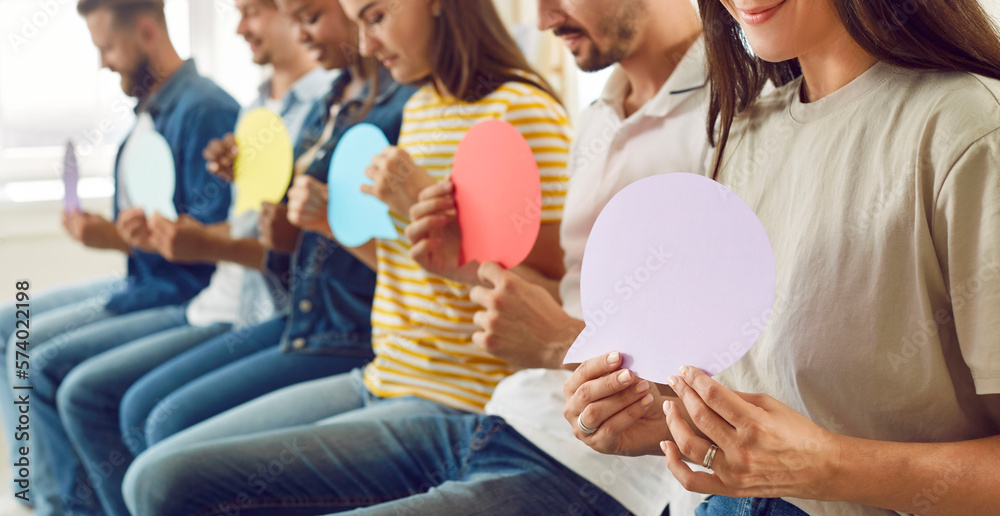 Team of diverse multiracial people sitting together, taking part in ...