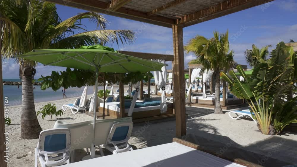 Beach cabanas overlooking the Caribbean Sea. Relax in the shade. Beach ...