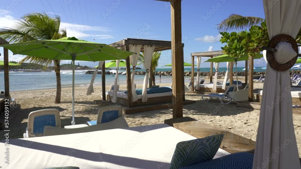 Beach cabanas overlooking the Caribbean Sea. Relax in the shade. Beach ...