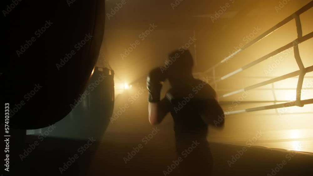 Caucasian man punching bag to support a healthy weight. Close-up view ...