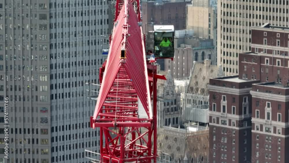 Tower crane in operation at construction site of downtown skyscraper in ...