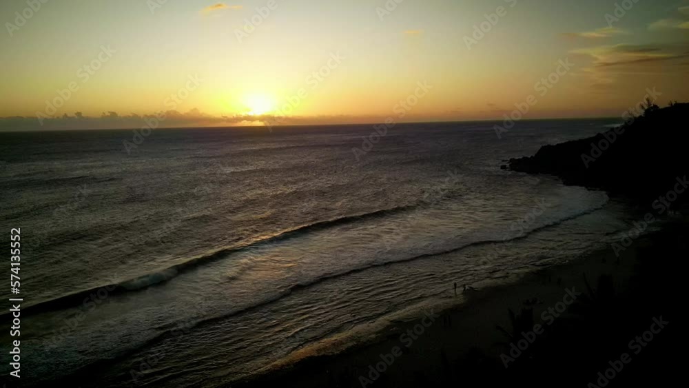 Slowmotion footage of sunset at golden hour as drone slowly descends ...