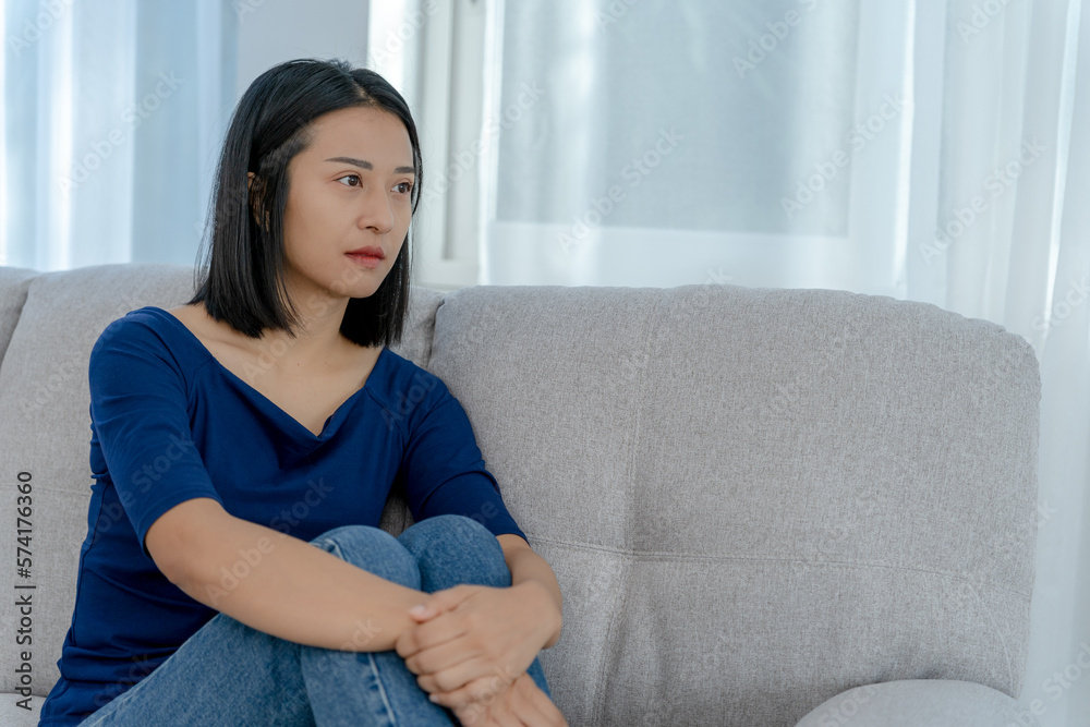 Depression and mental illness. Asian woman disappointed, sad after ...