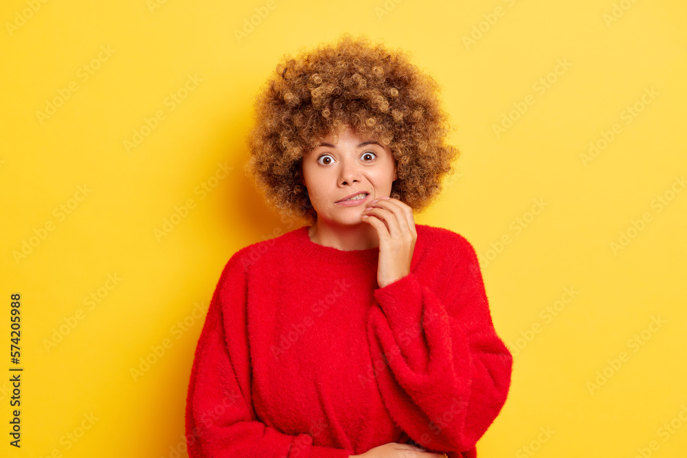 Worried embarrassed woman with Oops expression looks scared and guilty ...