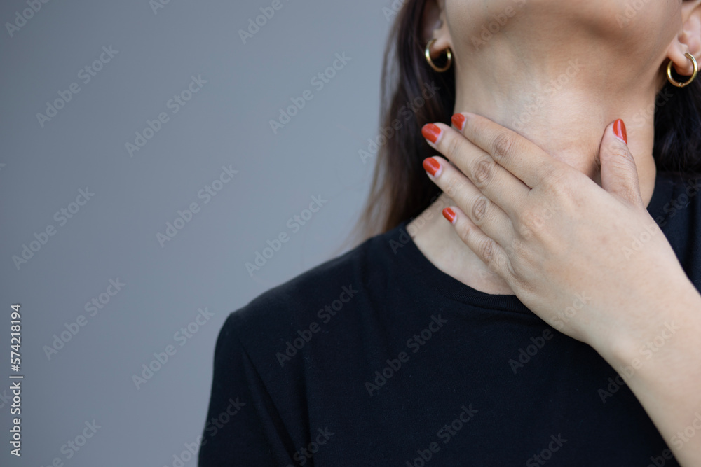 Beautiful young woman touching her sick neck with hands she has neck ...