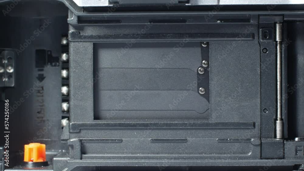 Actuation of the shutter mechanism of an old film camera inside the ...