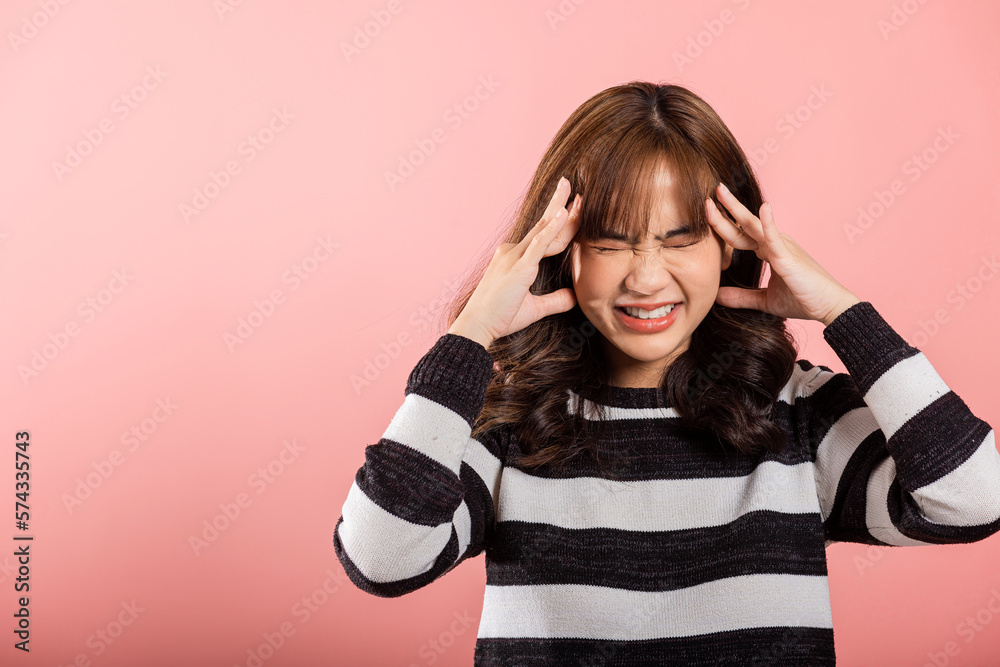 Portrait of beautiful Asian young woman sad tired strain face holding ...