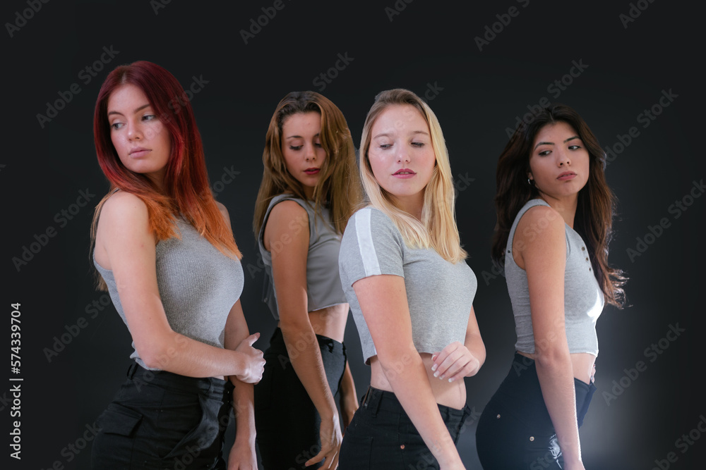 Foto de Group of young female fashion models posing on camera. Young ...