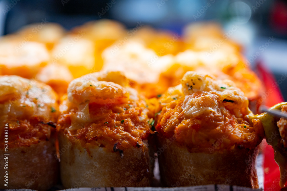 Typical snack of Basque Country, pinchos or pinxtos skewers with small ...