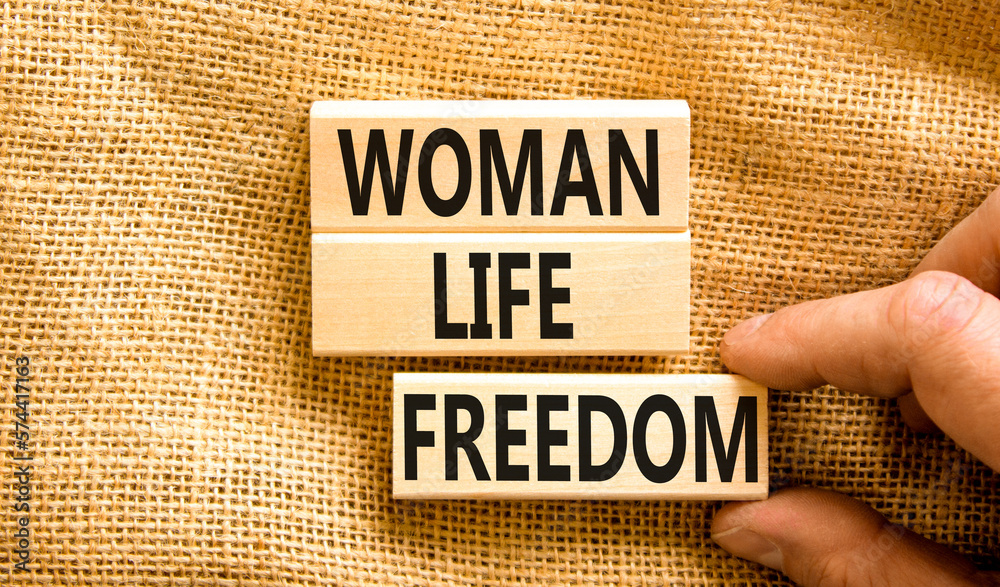 Woman life freedom symbol. Concept words Woman Life Freedom on wooden ...