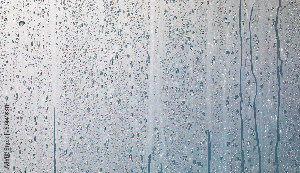 water drops on a window or in the shower cabin,wet transparent panorama ...