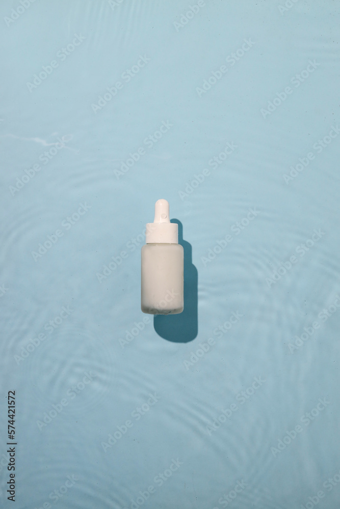 Skin care product mock up on water surface. Water ripples from top ...