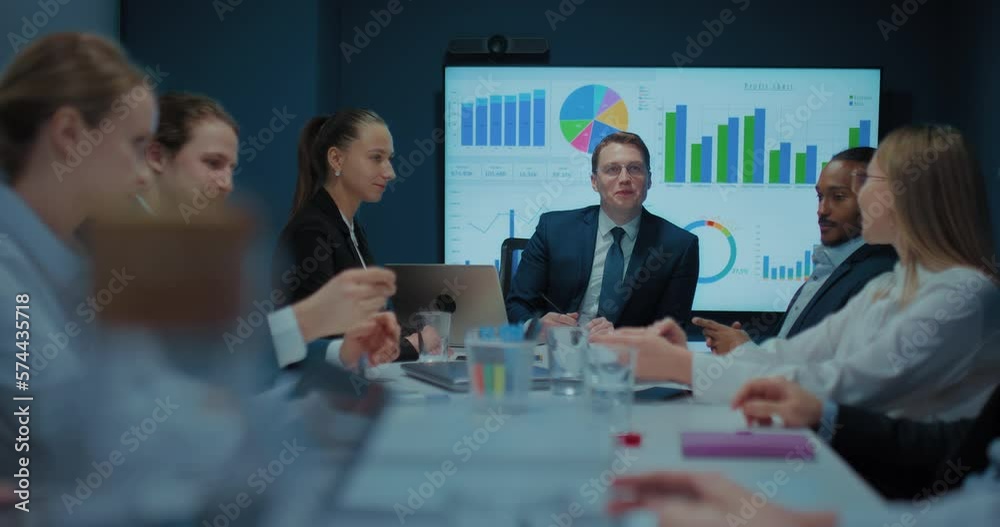 boss and multiethnic employees communicating in meeting room of office ...