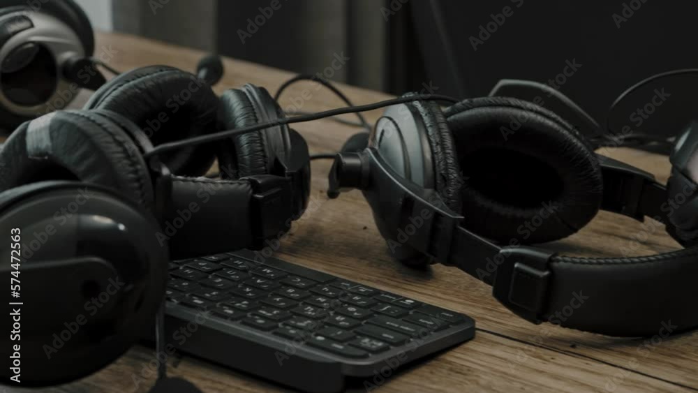lots of headphones on the desk after hours. call center office concept ...