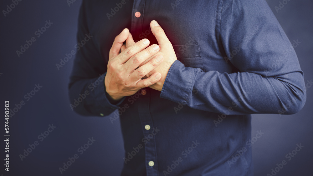 Adult man suffering from chest pain, Hand pressing on chest with ...
