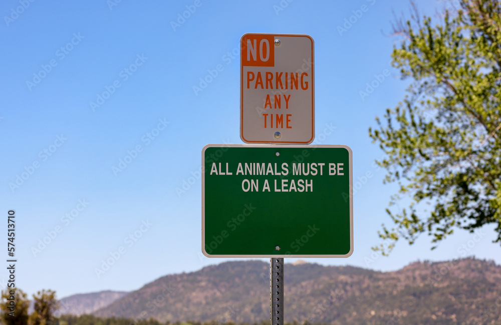 No parking any time and all animals must be on a leash signs. Stock ...