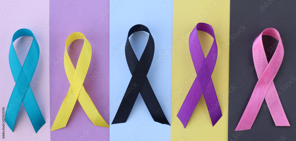 World cancer day. Colorful awareness ribbons on different color ...