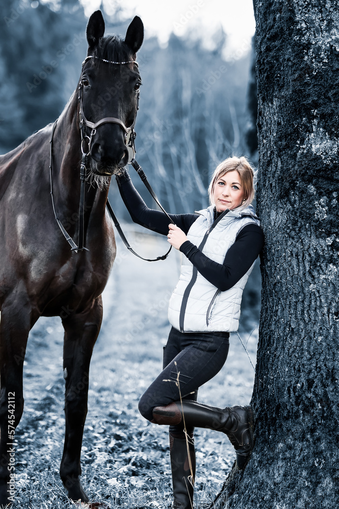 Horse and rider stand by a tree and both look into the camera, edited ...