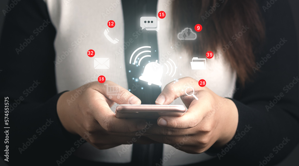 Business people holding smartphone with virtual bell ringing and icons ...