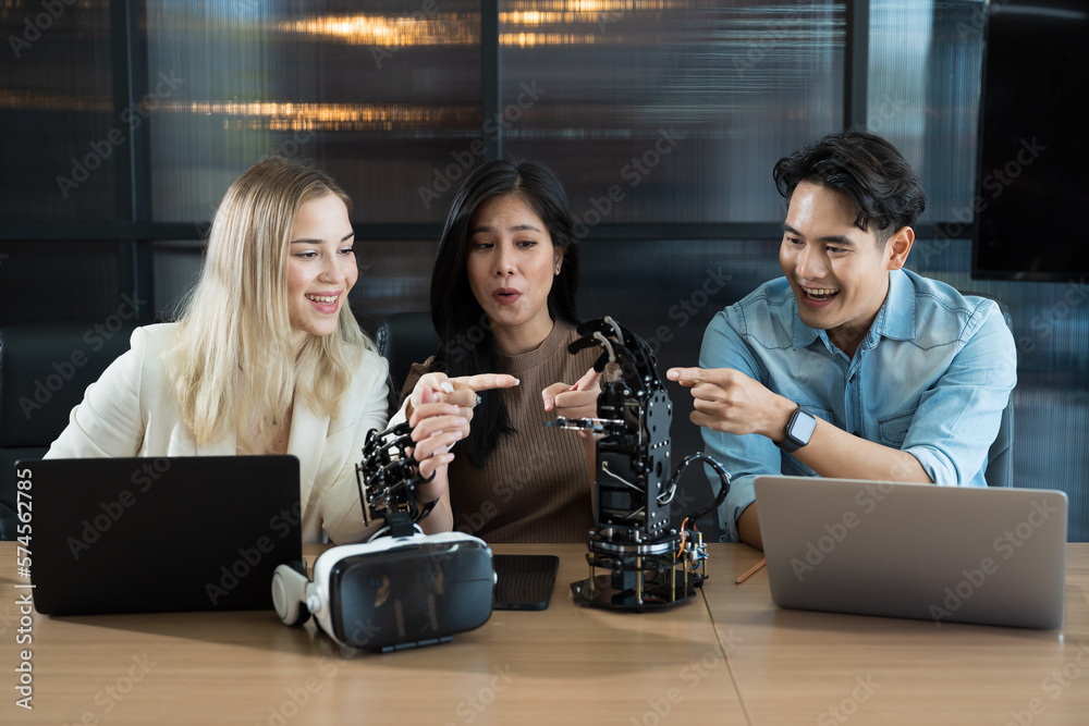 Male and female engineer working with AI robot arm system project in ...