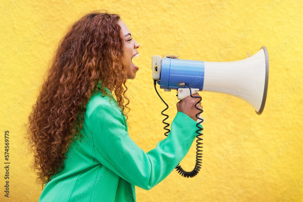 Megaphone, woman and screaming on yellow background of speech ...