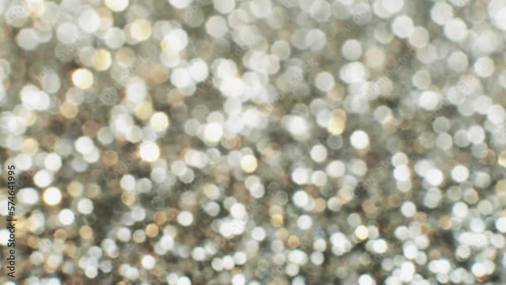 Spangle magic. Defocused lights. Silver background. Light tinsels ...
