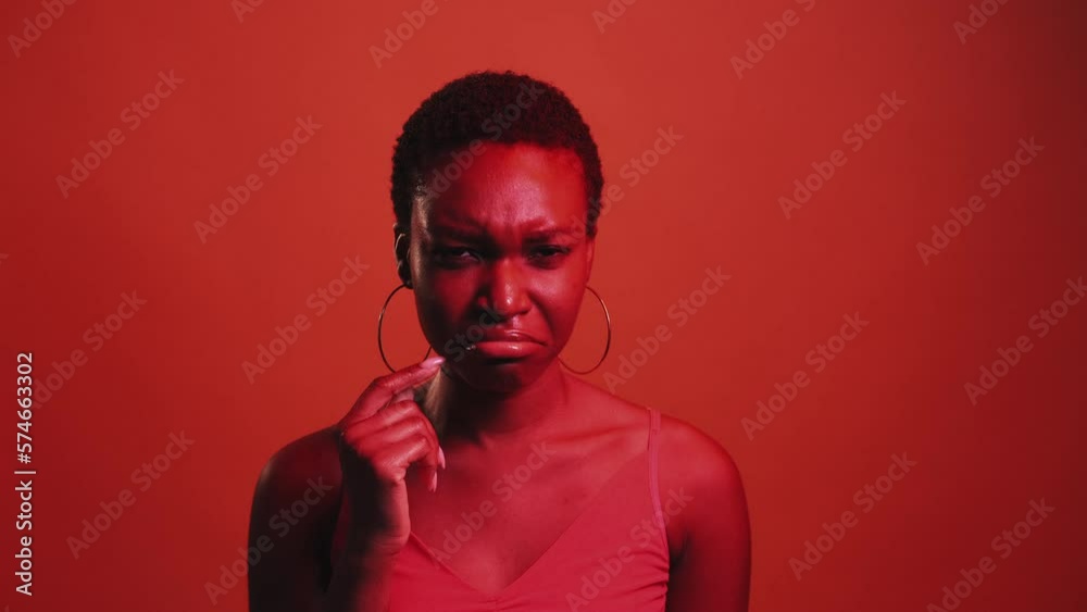 Upset grimace. Depressed mood. Offence regret. Red neon color light ...