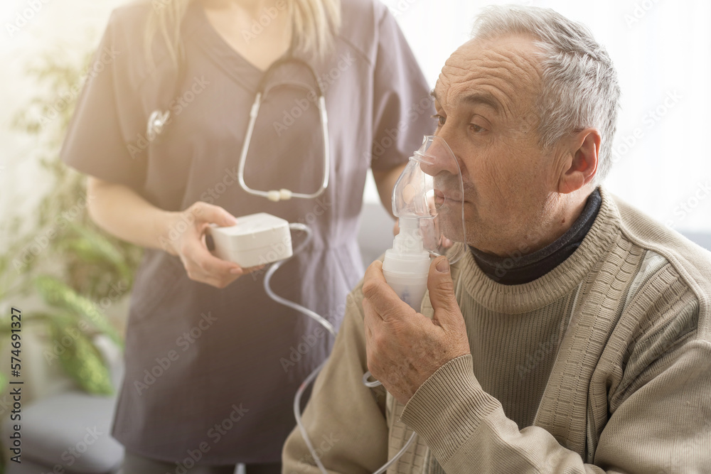 Elderly Senior Man nursing care wear oxygen inhaler device for helping ...