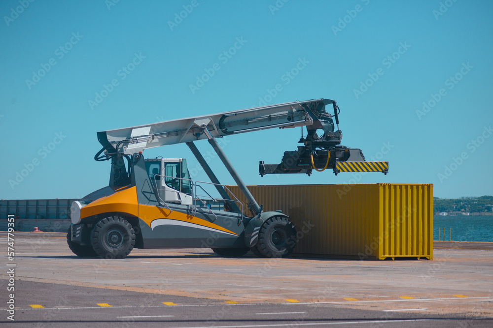 Forklift truck handling container box, loading container in the port ...