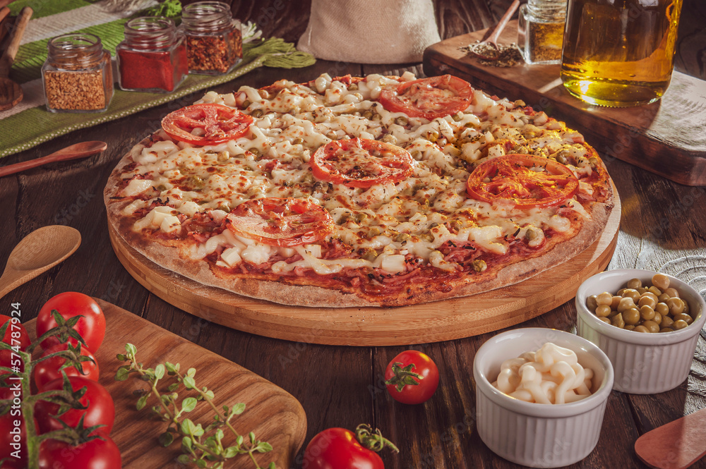 Brazilian pizza with mozzarella cheese, ham, tomato, hearts of palm ...