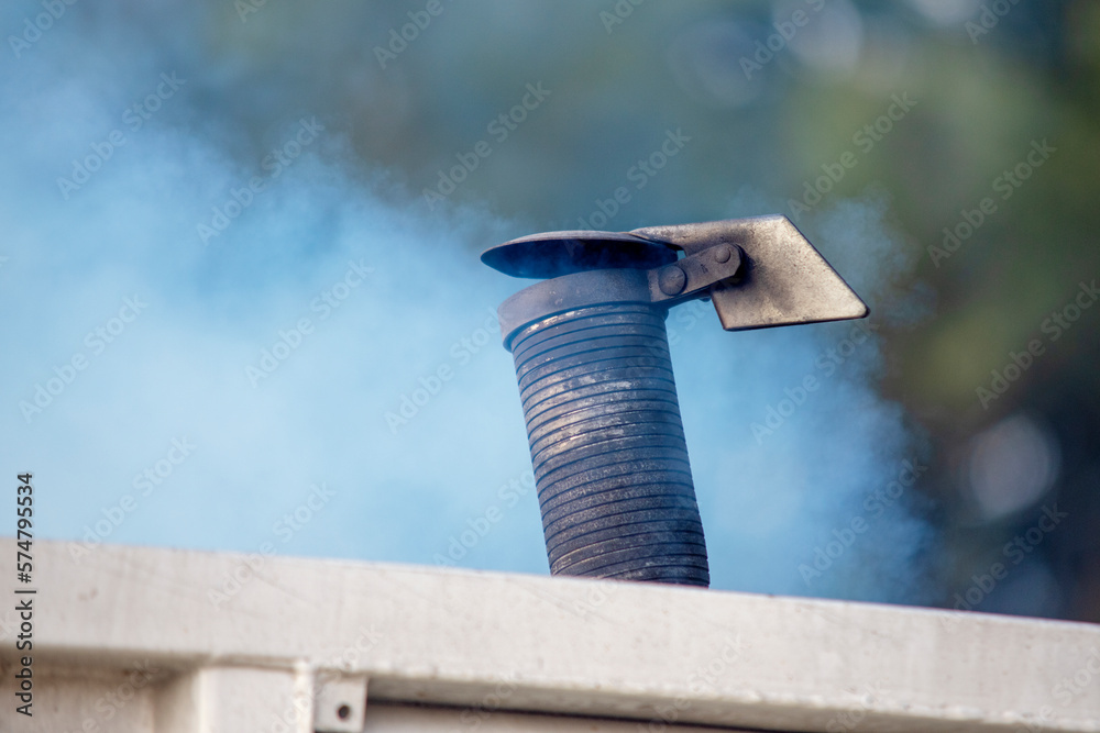 air pollution incident as a faulty diesel power generator exhaust pipe ...