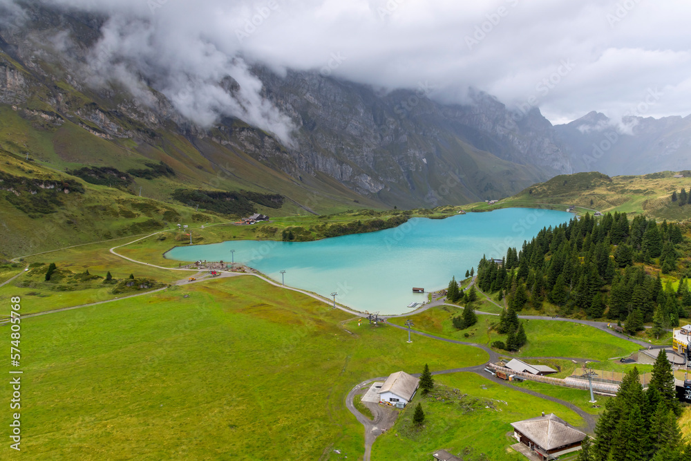 Aerial view of the light blue turquoise waters of the Alpine Lake ...