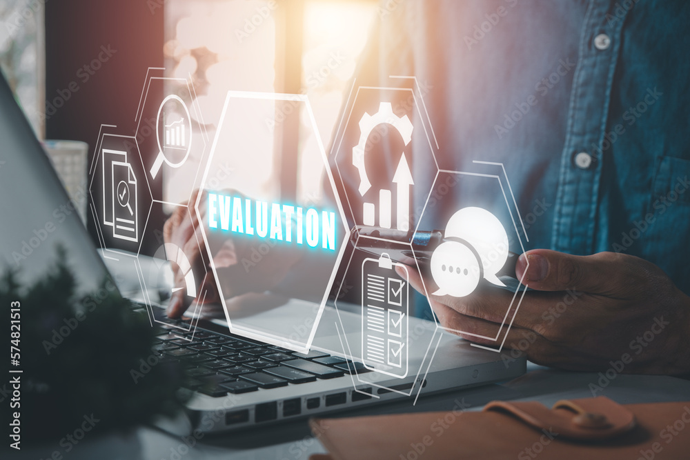 Evaluation concept, Person hand using laptop computer on desk with ...