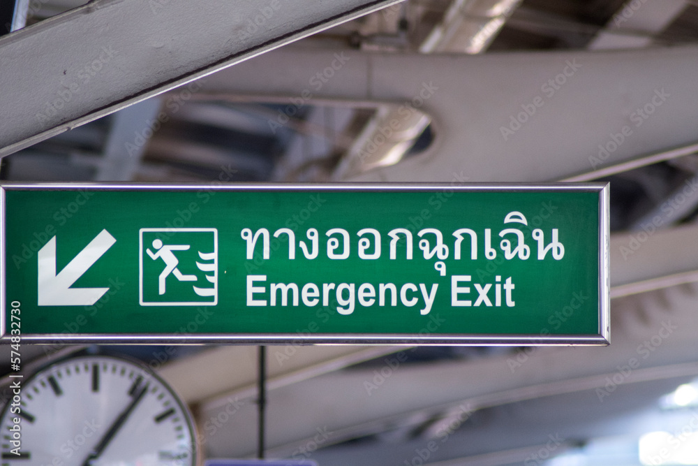 Emergency Exit sign with green light box is placed on BTS station ...