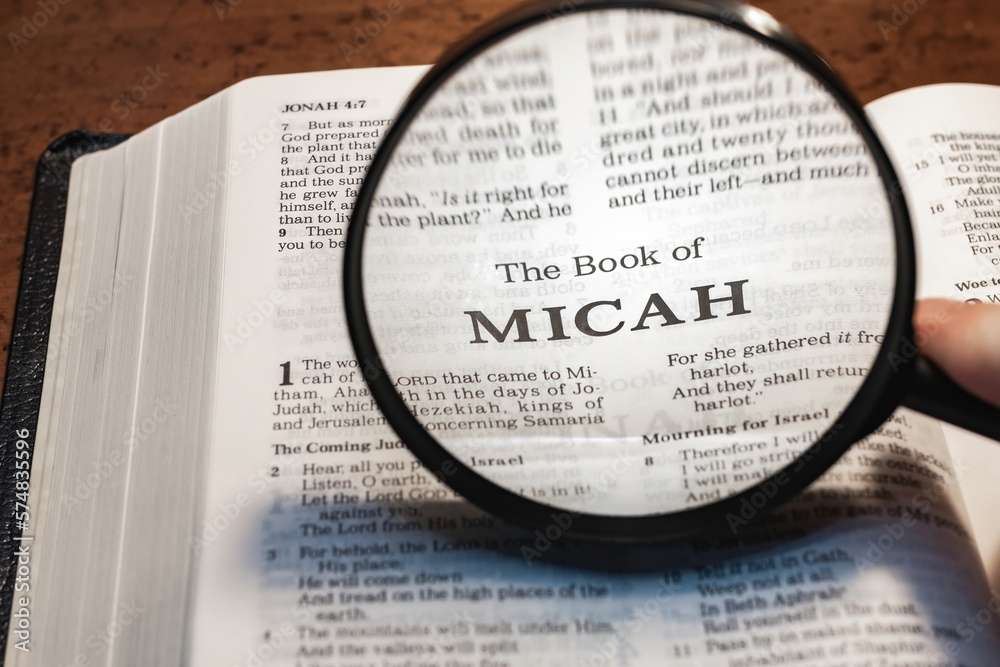 title page book of micah close up using magnifying glass in the bible ...