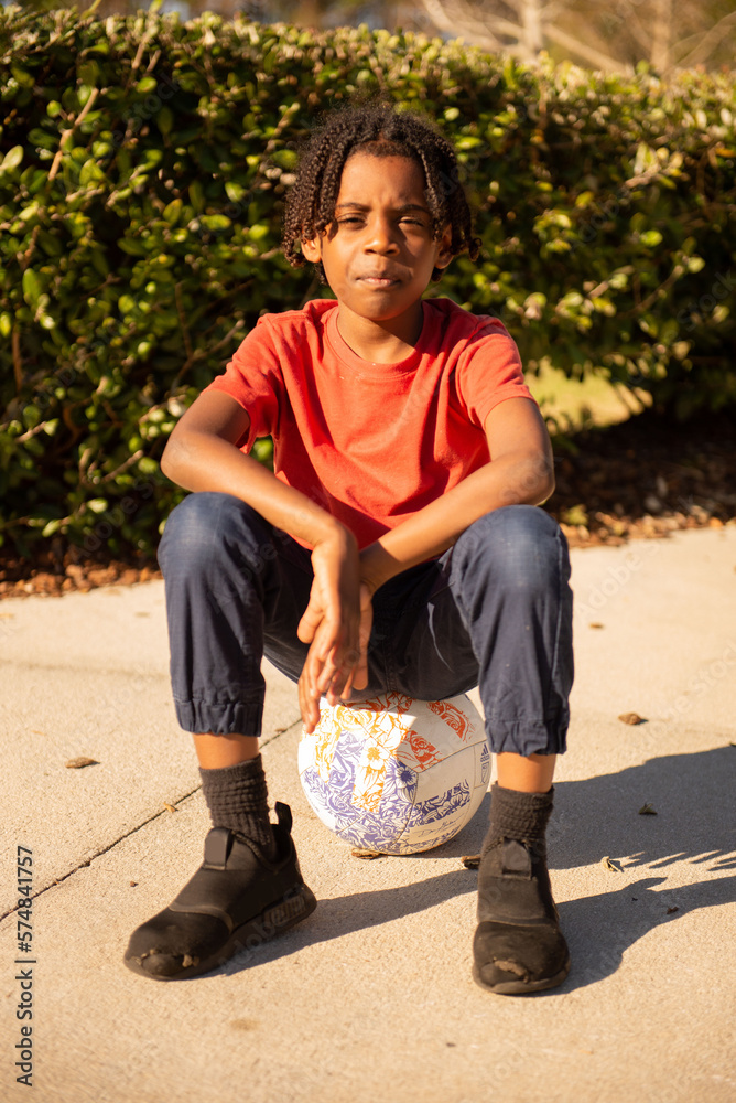 Boy with football Stock Photo | Adobe Stock