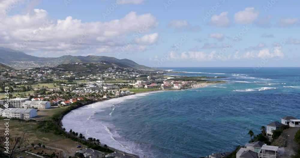 Vídeo do Stock: Waves wash ashore on Half Moon Bay at Kittitian Village ...