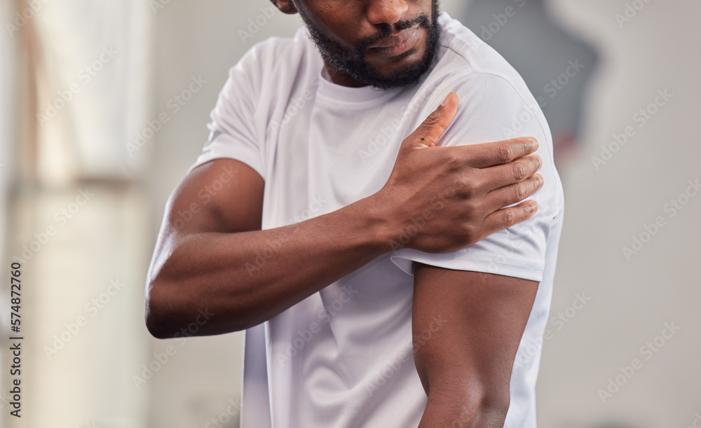 Shoulder pain, fitness and black man with injury in gym after accident ...